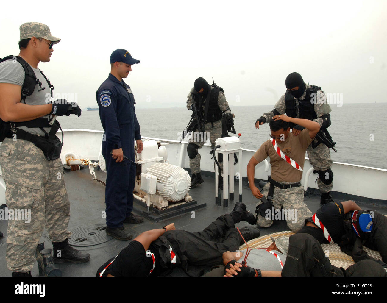 A U.S. Coast Guard maritime safety and security team member, second ... A U.S. Coast Guard maritime safety and security team member, second ...