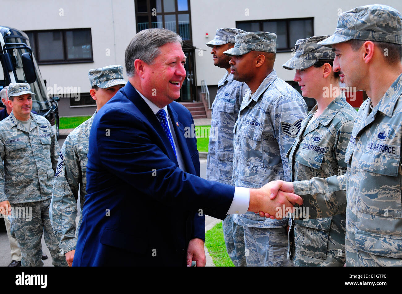 Secretary of the Air Force Michael Donley, center, greets staff members ...