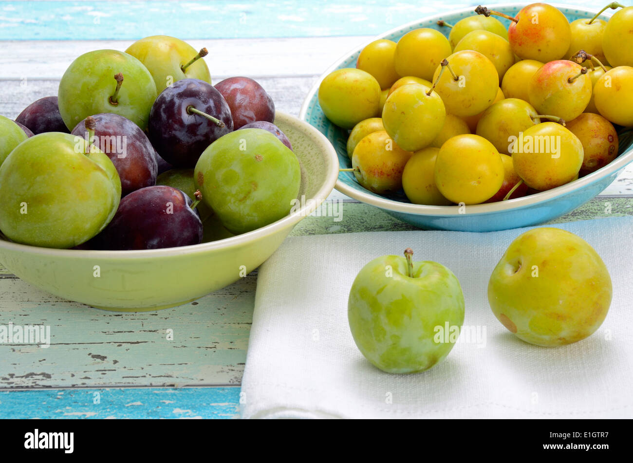 Bowls full of various plums Stock Photo - Alamy