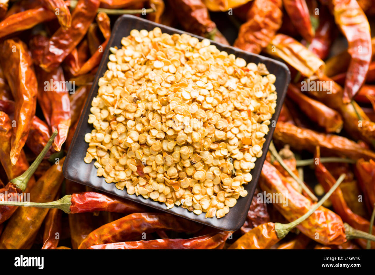 Red chili peppers and seeds Stock Photo - Alamy