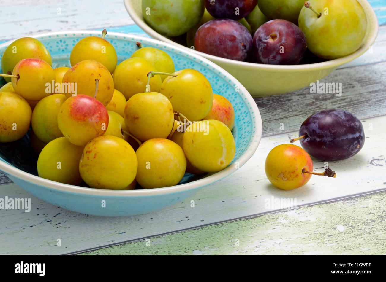 Bowls full of various plums Stock Photo - Alamy