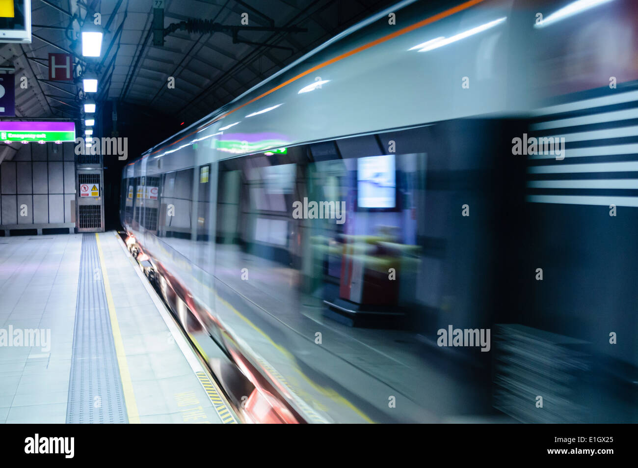 Heathrow Express train arrives at the platform at Heathrow Airport ...
