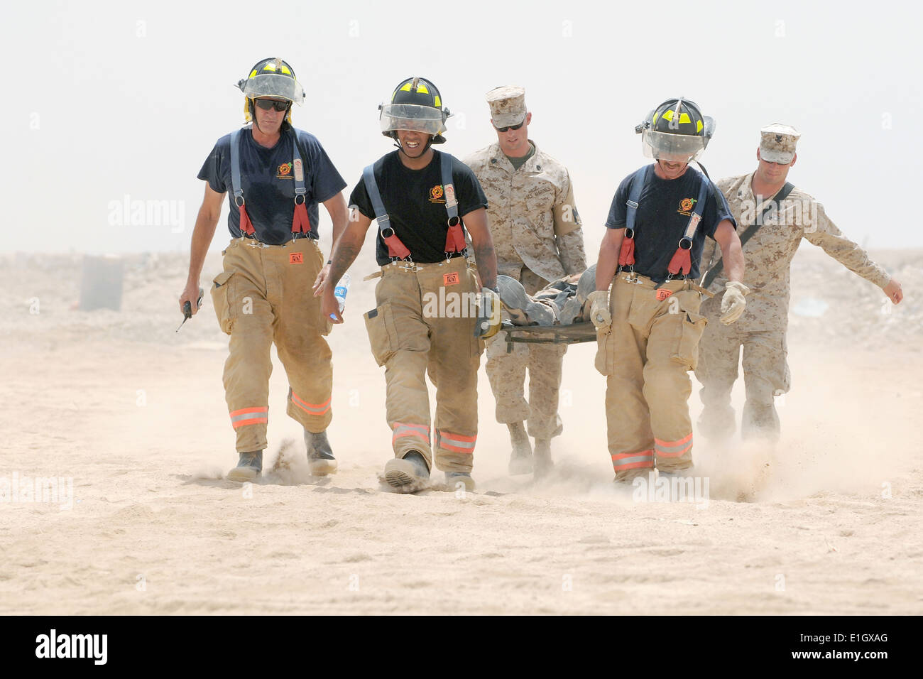 Emergency Services personnel at Camp Leatherneck, Afghanistan, treat a ...