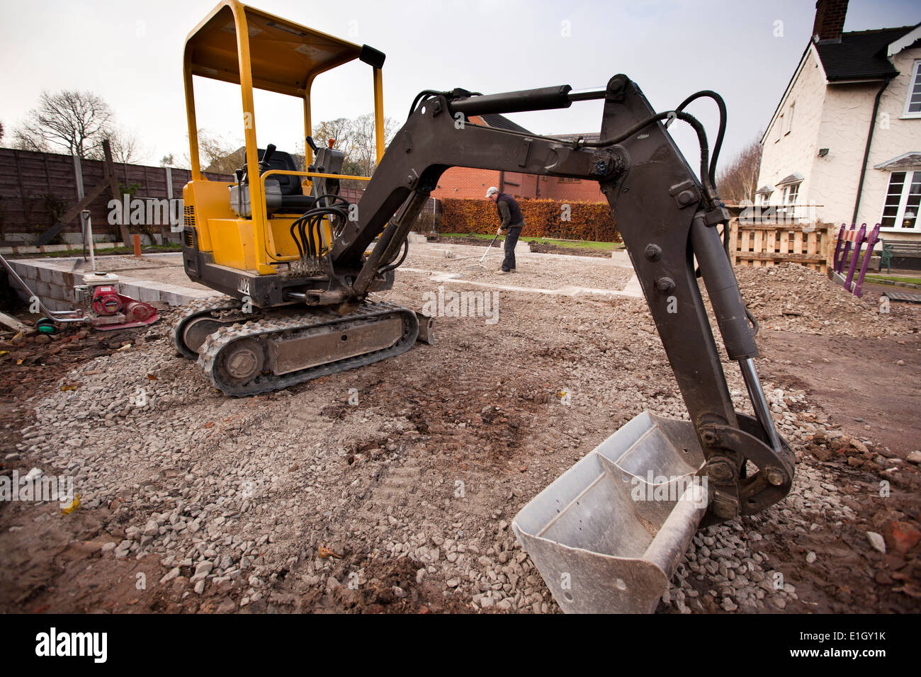 self building house, raking foundation infill level with compacted MOT ...