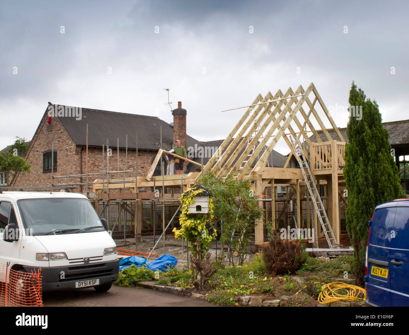 self building house, erecting green oak structure, fixing roof spars ...