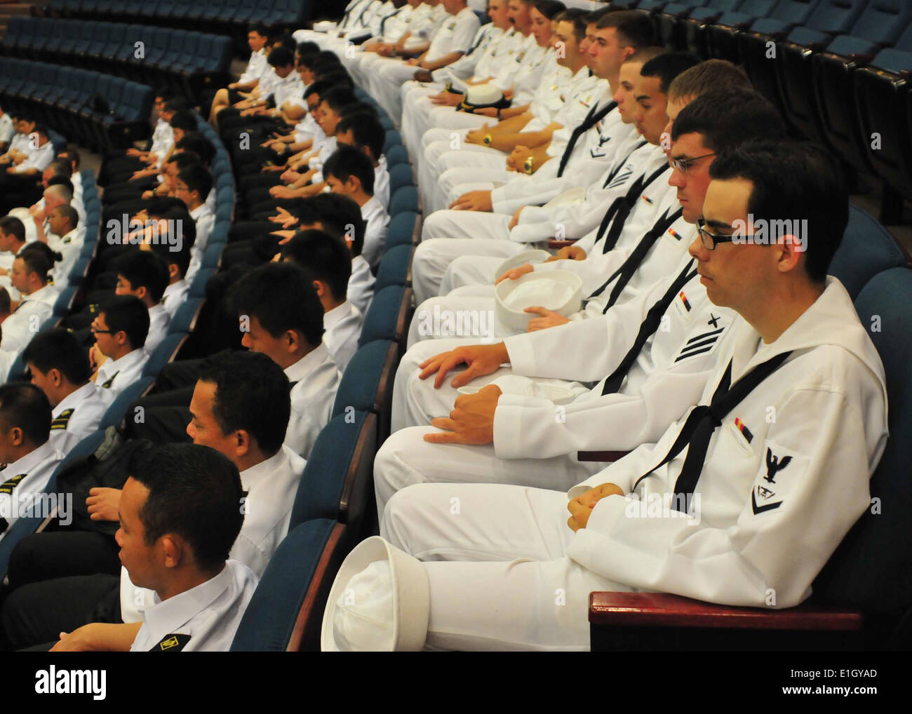 U.S. Sailors, top row, and Republic of Singapore Navy sailors listen to ...