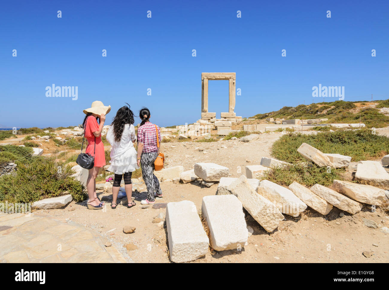 Tourists at the Temple of Apollo Arch, Naxos Island, Cyclades, Greece ...