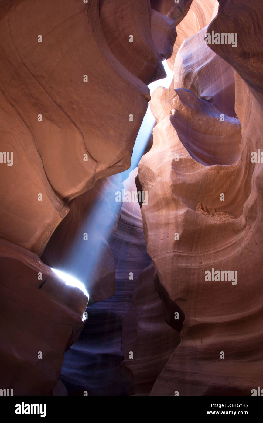 Single beam of light shining on wall of narrow slot canyon Stock Photo ...