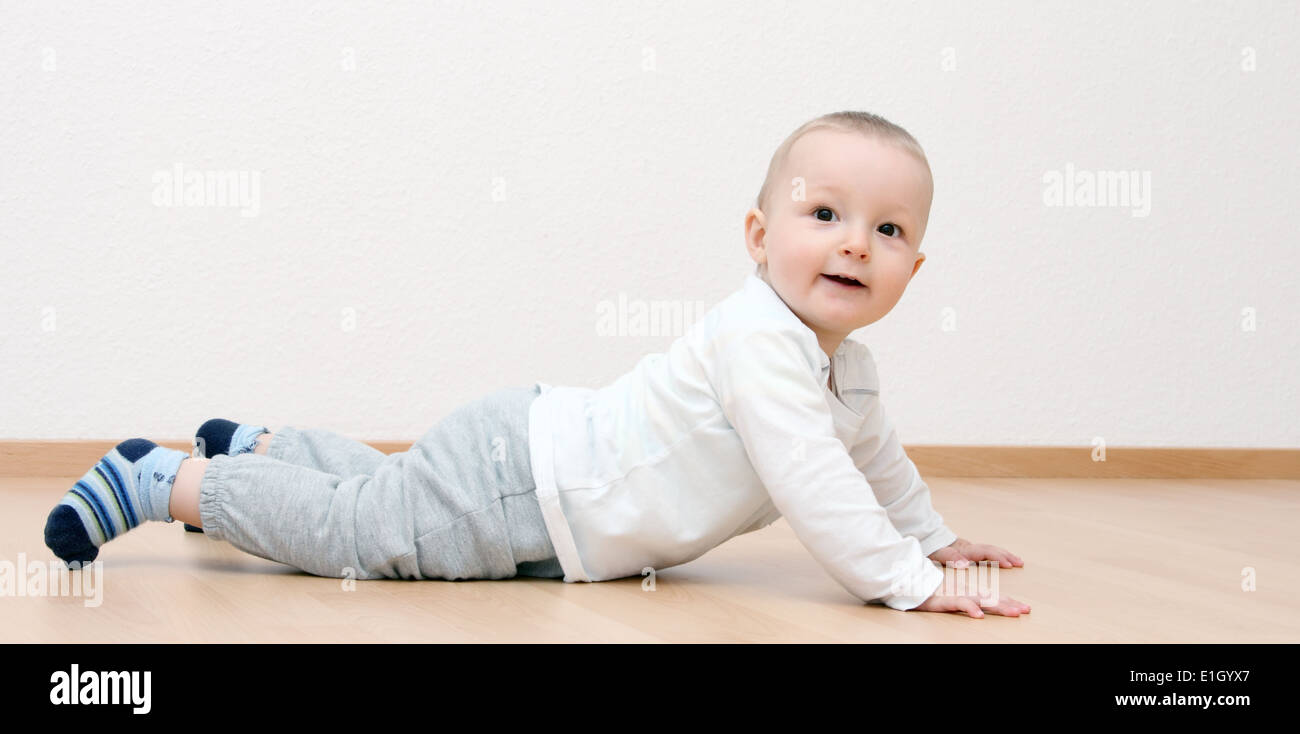 happy baby boy crawling Stock Photo - Alamy