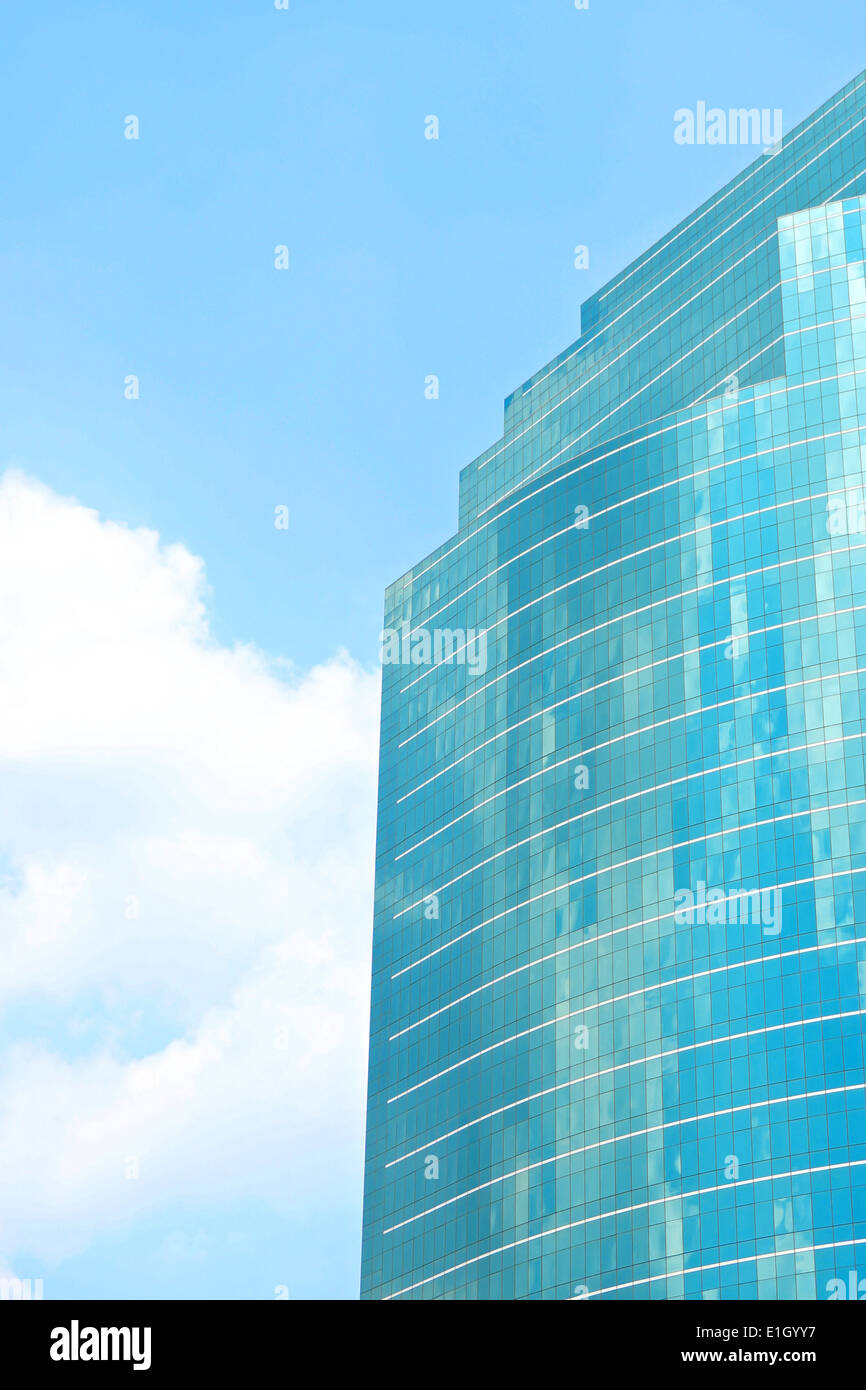 Skyscraper building with blue glass reflection blue sky with cloud ...