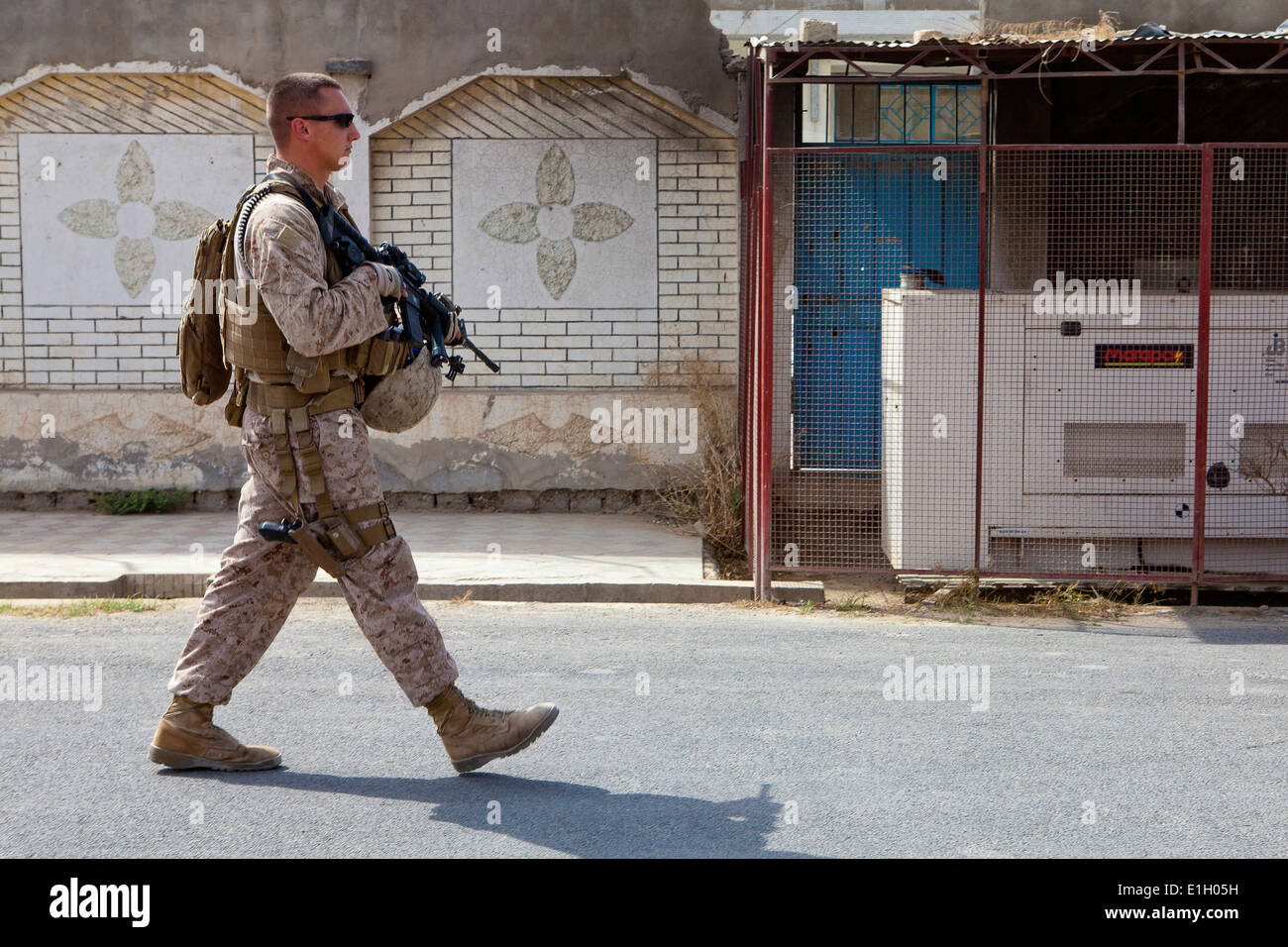 U.S. Marine Corps Lance Cpl. Eric Devine, a personal security ...
