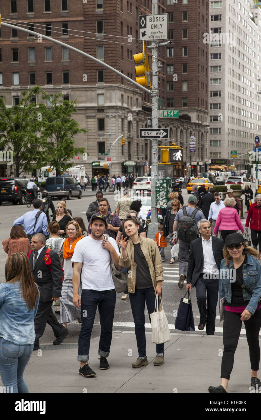 People on 6th Ave at 54th Street in Manhattan, NYC Stock Photo - Alamy