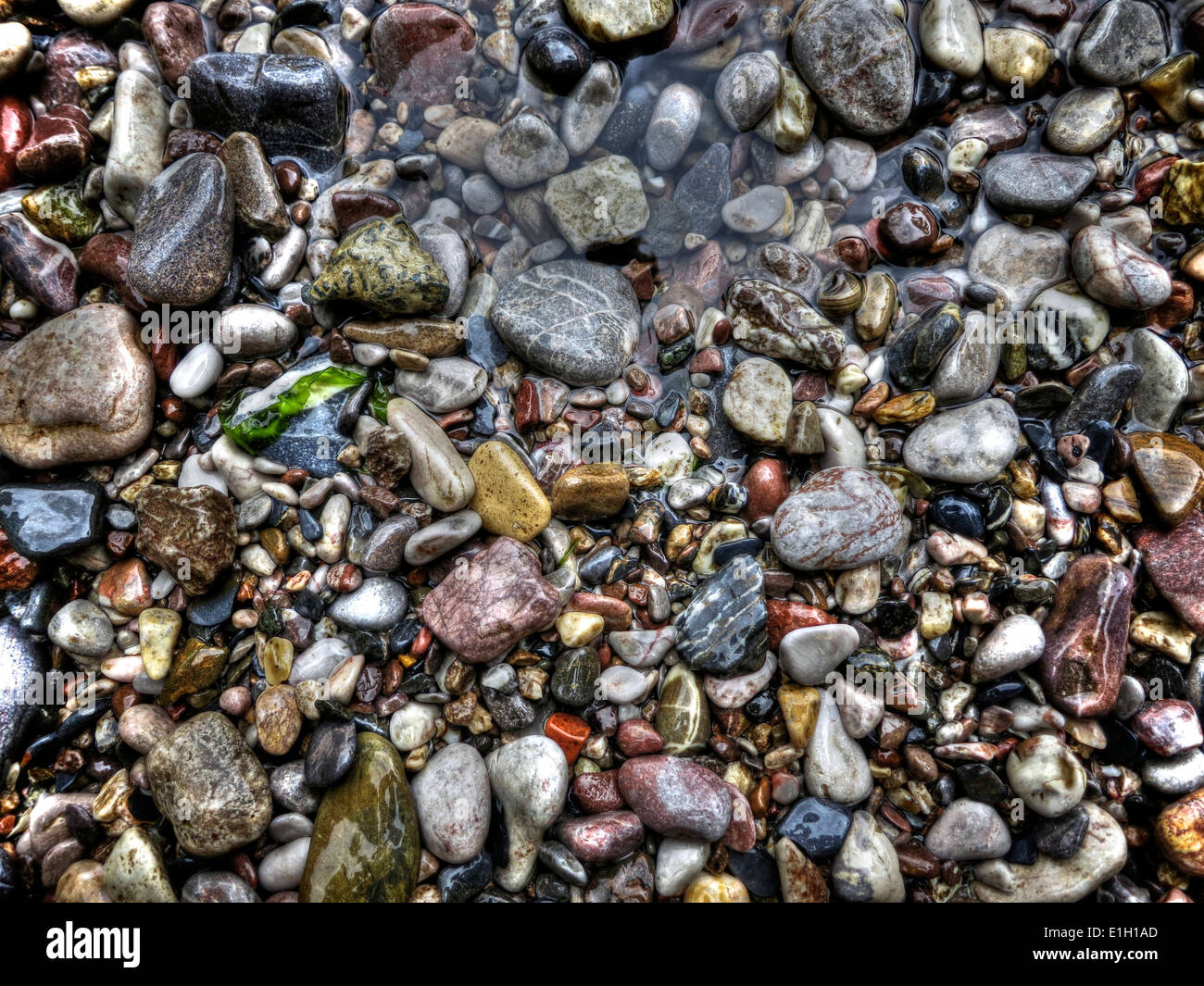 Pebbles on beach coloured pebbles hi-res stock photography and images ...