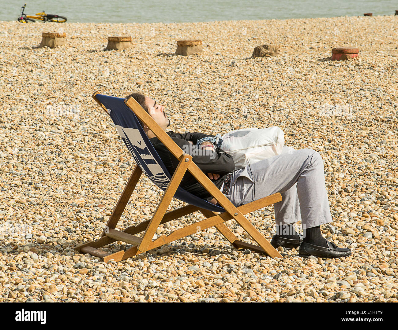 Man relaxing on the beach Stock Photo - Alamy