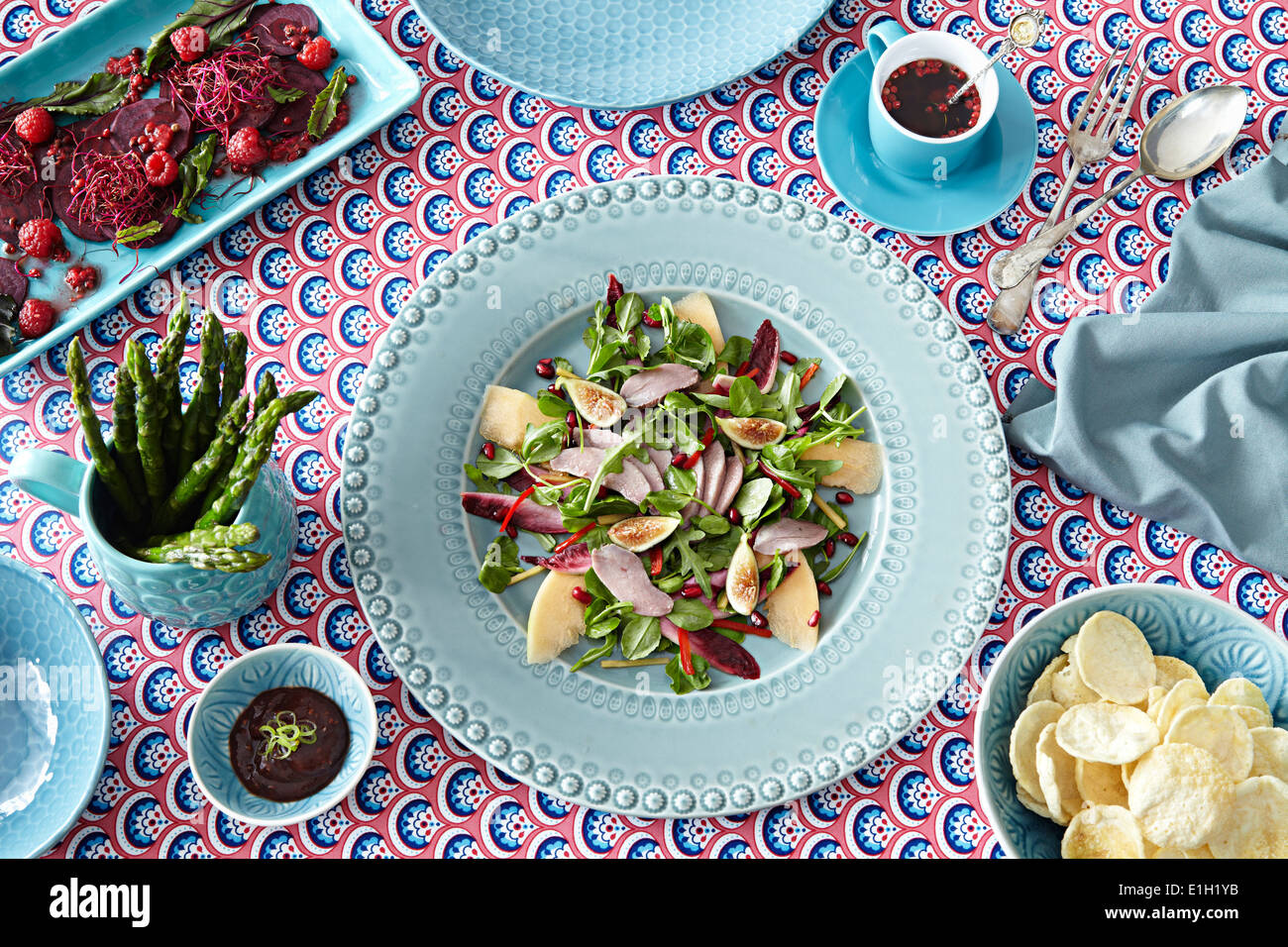 Still life of foods on matching crockery Stock Photo - Alamy