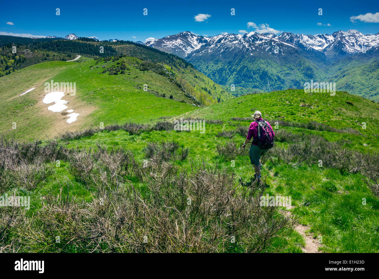 Female walker in red top, Plateau de Beille, French Pyrenees, distant ...