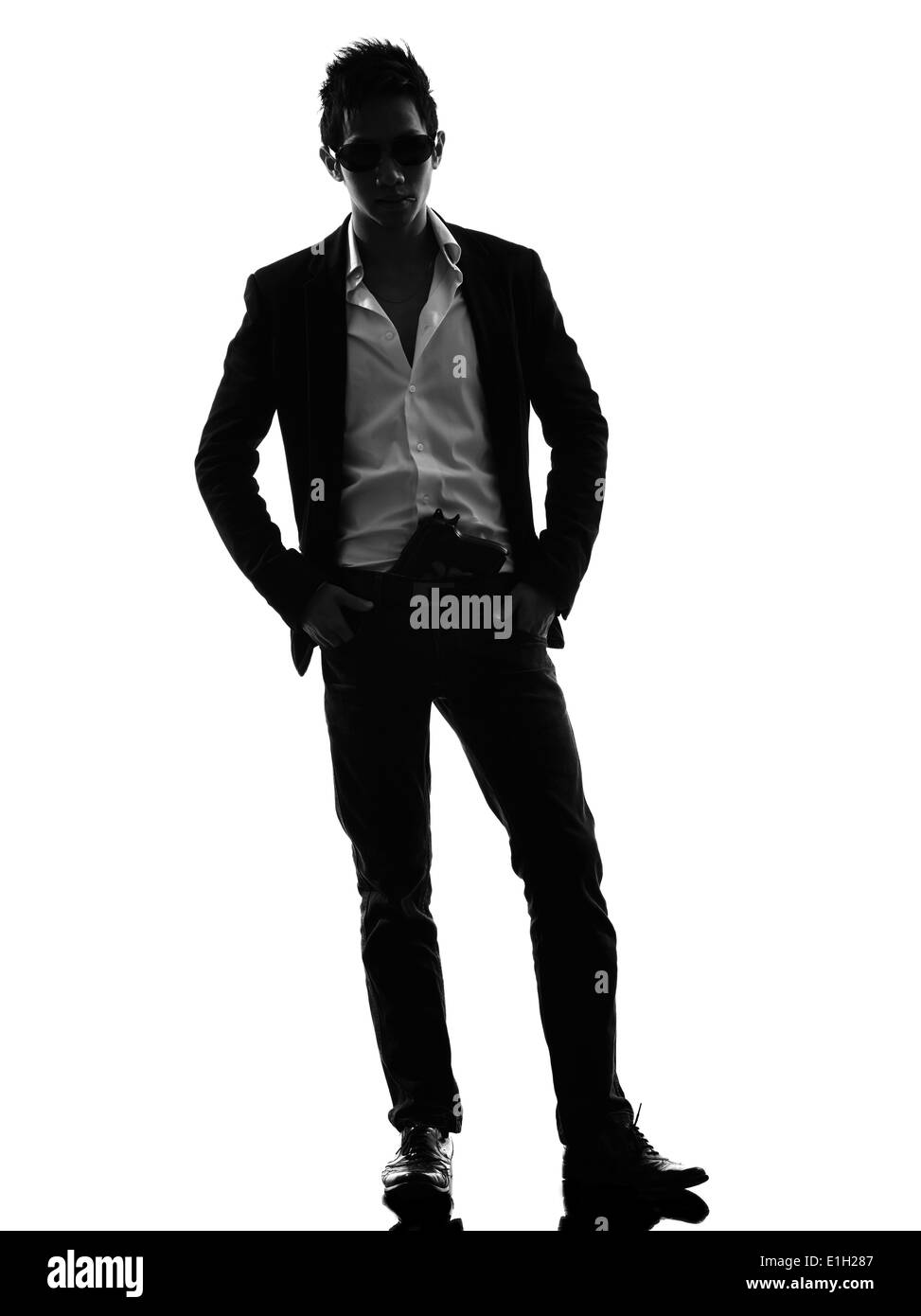 one asian gunman killer standing in silhouette isolated white ...