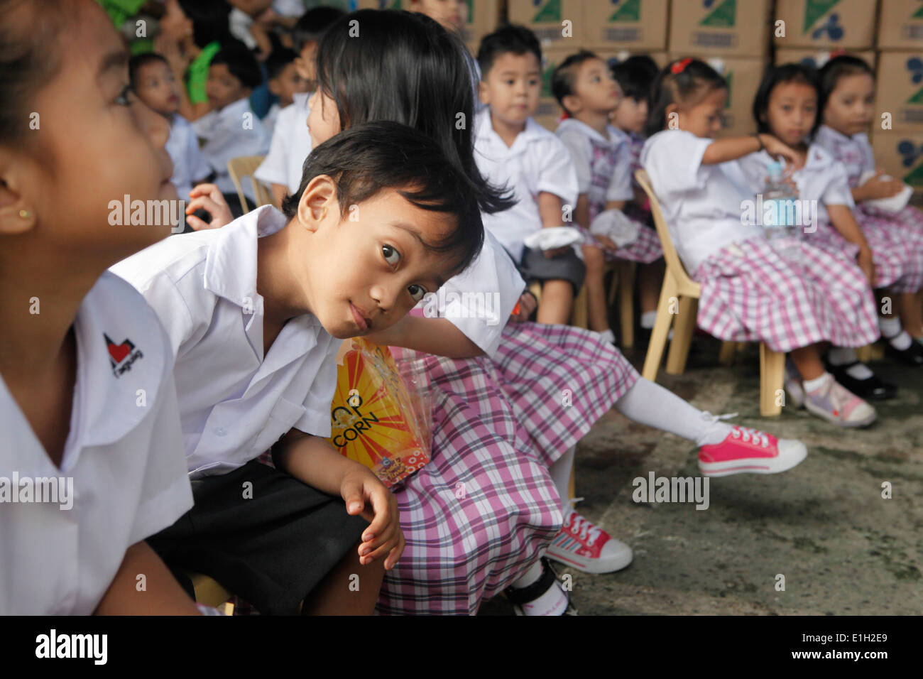 Filipino schoolchildren wait for U.S. Marine Corps Brig. Gen. Craig ...
