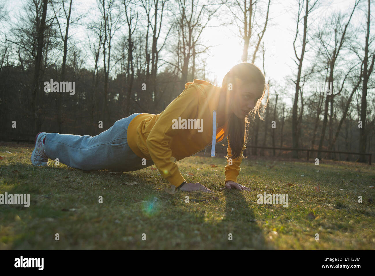 Woman runner doing warm up hi-res stock photography and images - Alamy