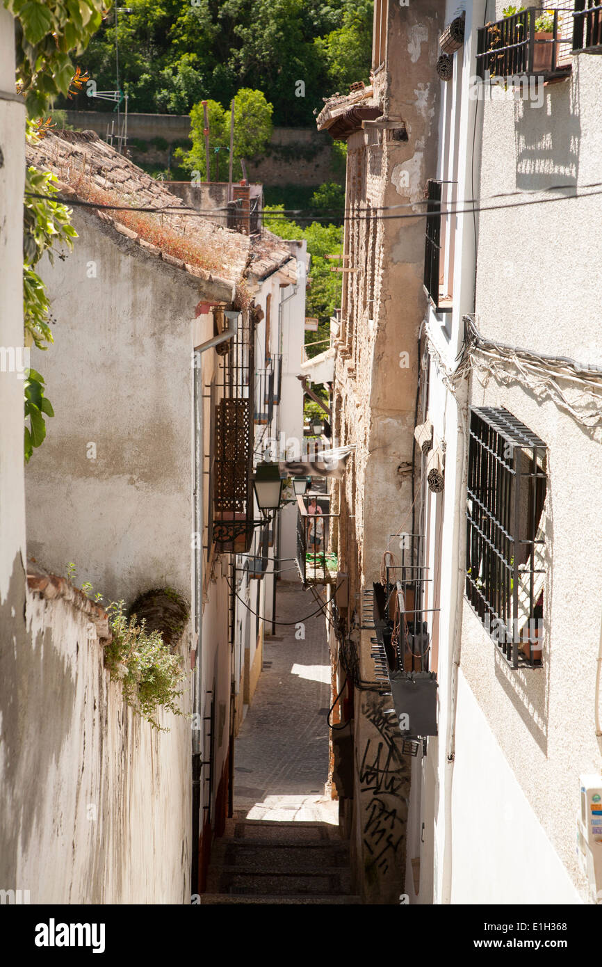 Narrow alleyway named Candil in the Moorish housing district of ...