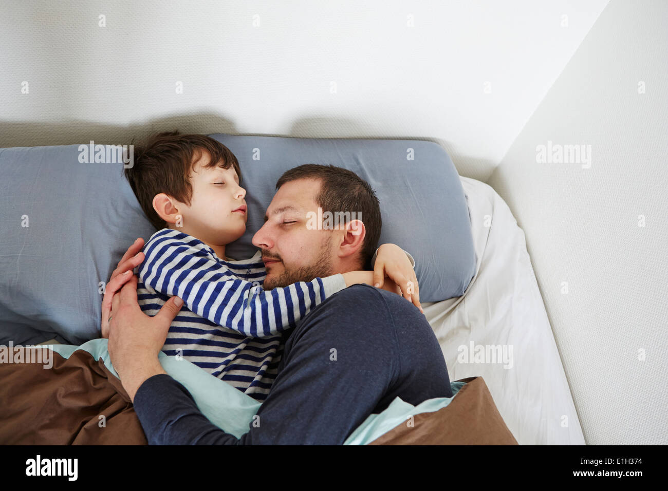 Father and son in bed Stock Photo - Alamy