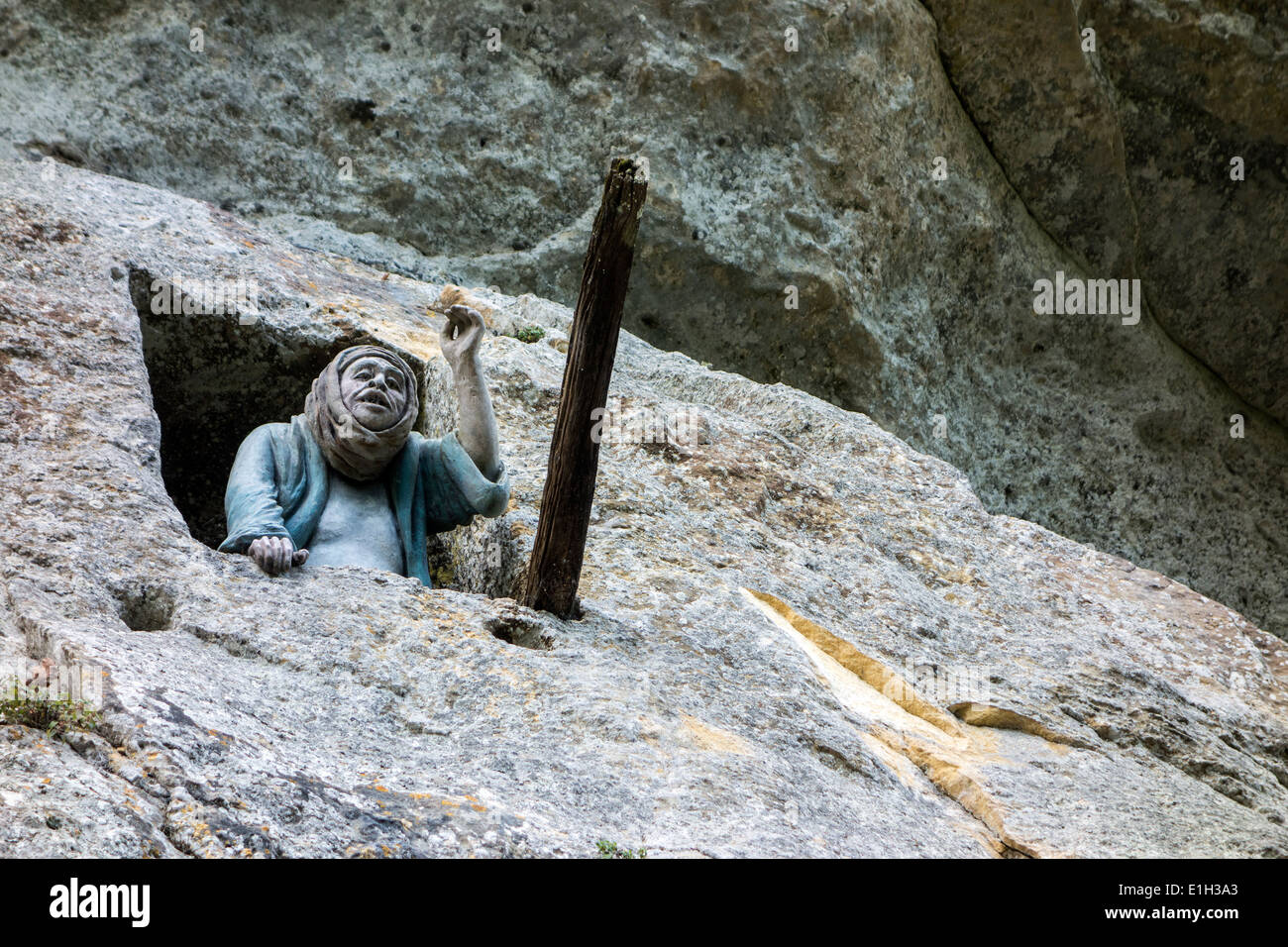 Medieval sentry looking through window of guard post at fortified ...