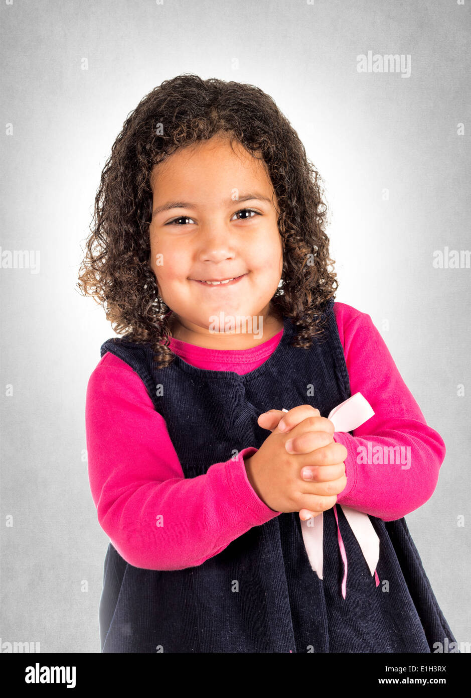 Portrait of positive little girl with smile on her face Stock Photo - Alamy