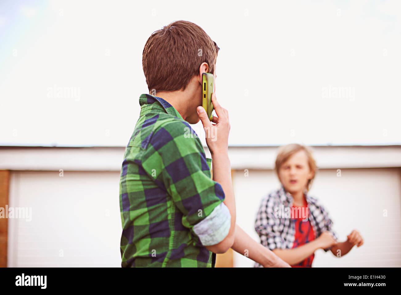 Boy on cell phone Stock Photo - Alamy