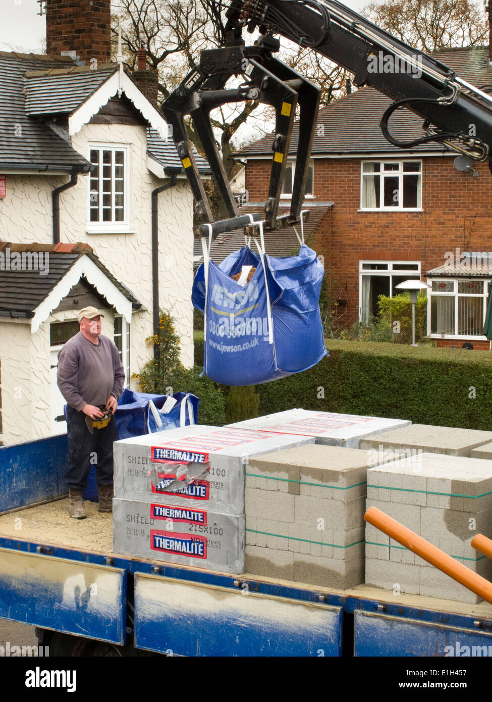 self building house, delivery of building materials being lifted from ...