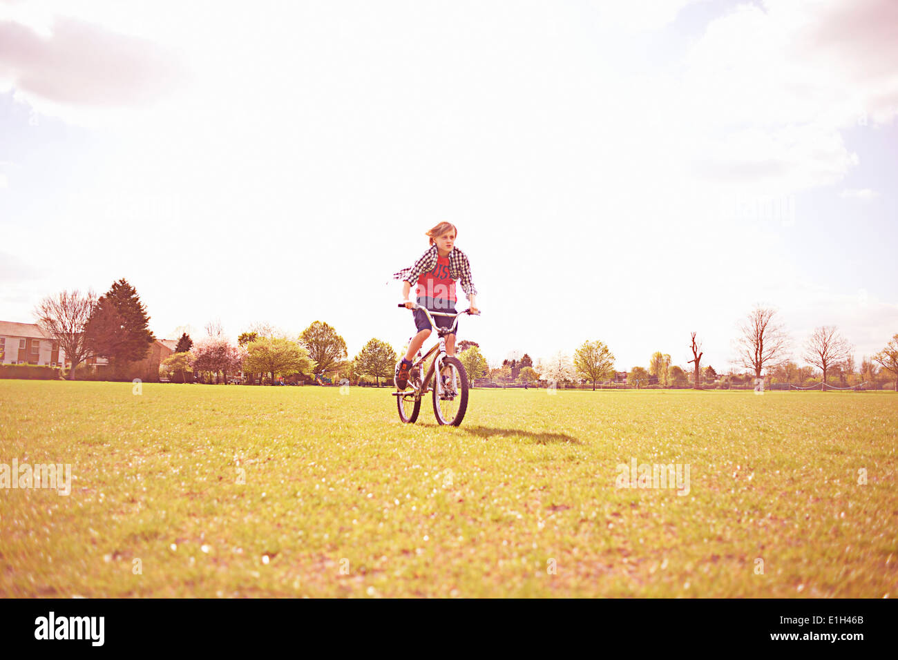 Cycling on grass hi-res stock photography and images - Alamy