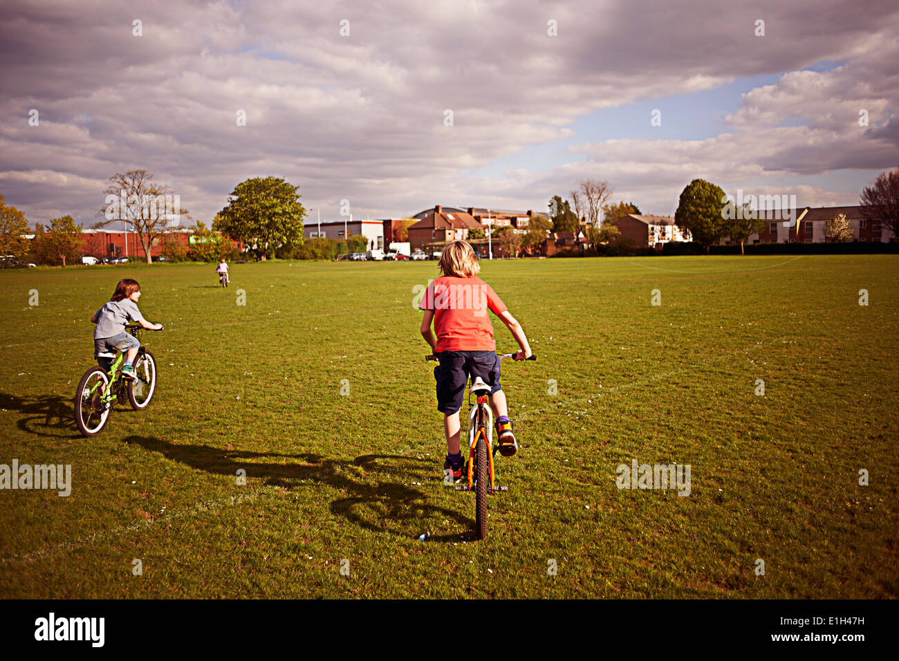 Two boys cycling hi-res stock photography and images - Alamy