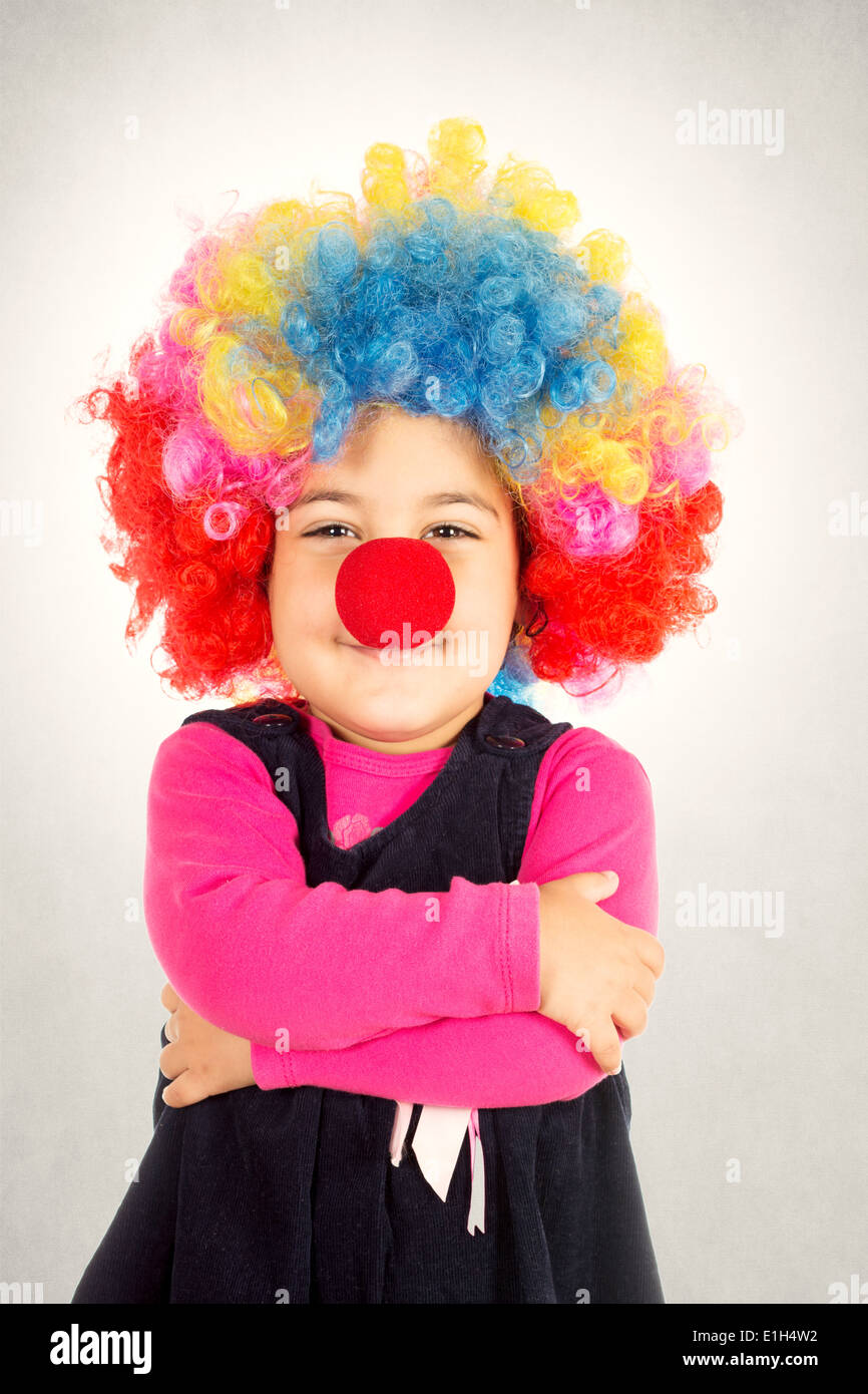 Happy little clown with crossed hands Stock Photo - Alamy