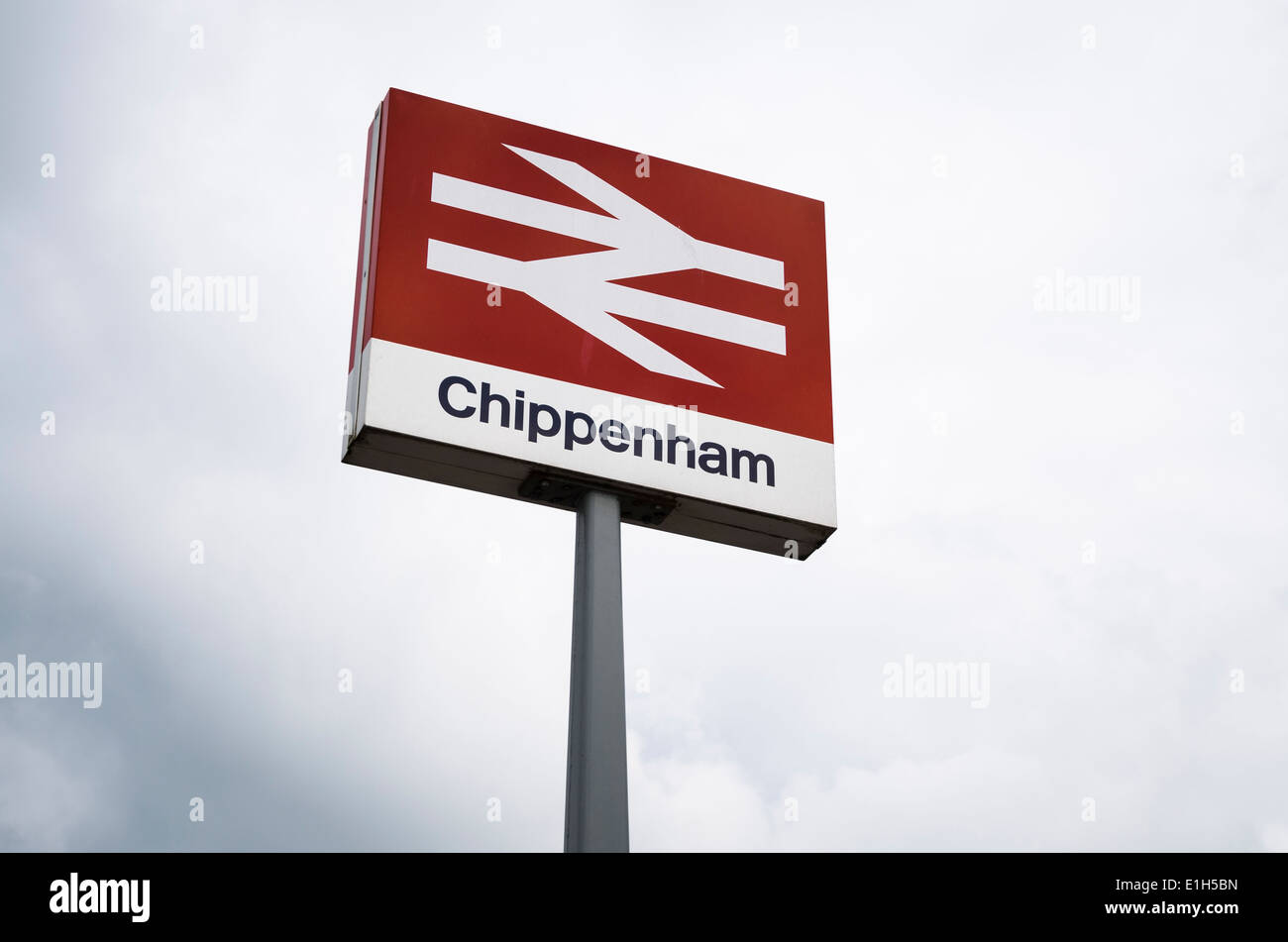 Prominent road sign indicating location of Chippenham railway station ...