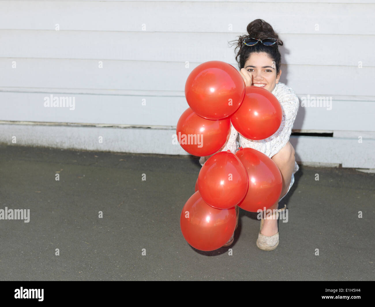 Crouching woman hi-res stock photography and images - Alamy