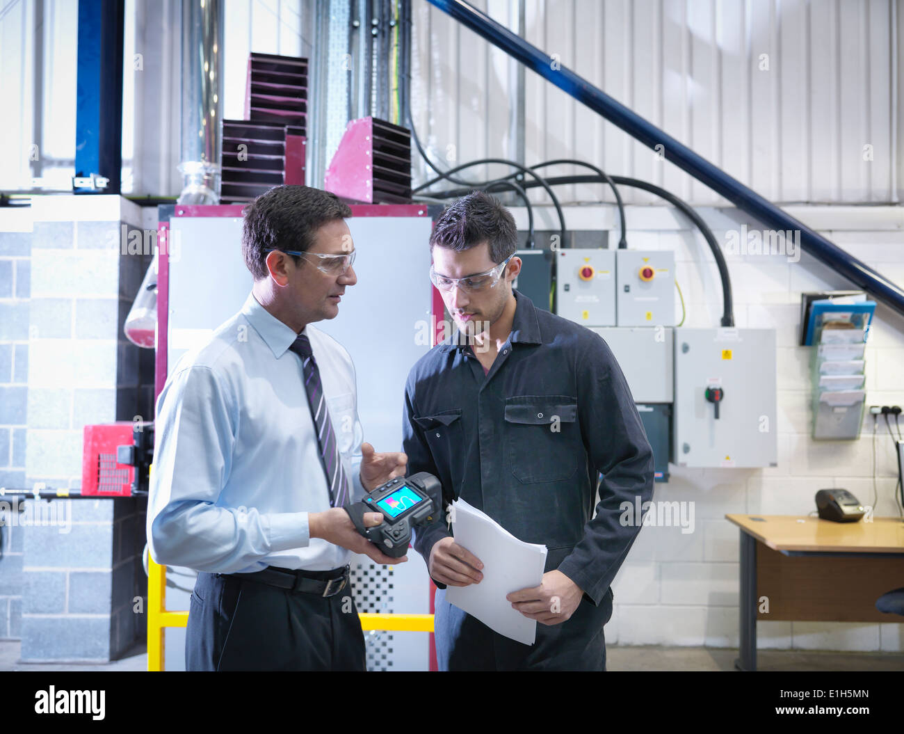 Man in red boiler suit hi-res stock photography and images - Alamy