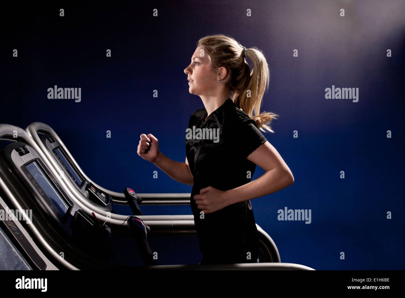 Young sporty female running in hi-res stock photography and images - Alamy