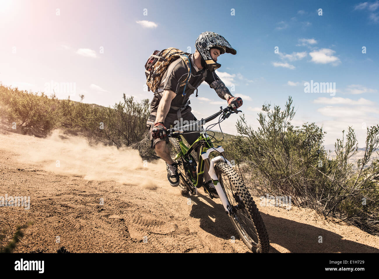 Mountain biker riding downhill Stock Photo - Alamy