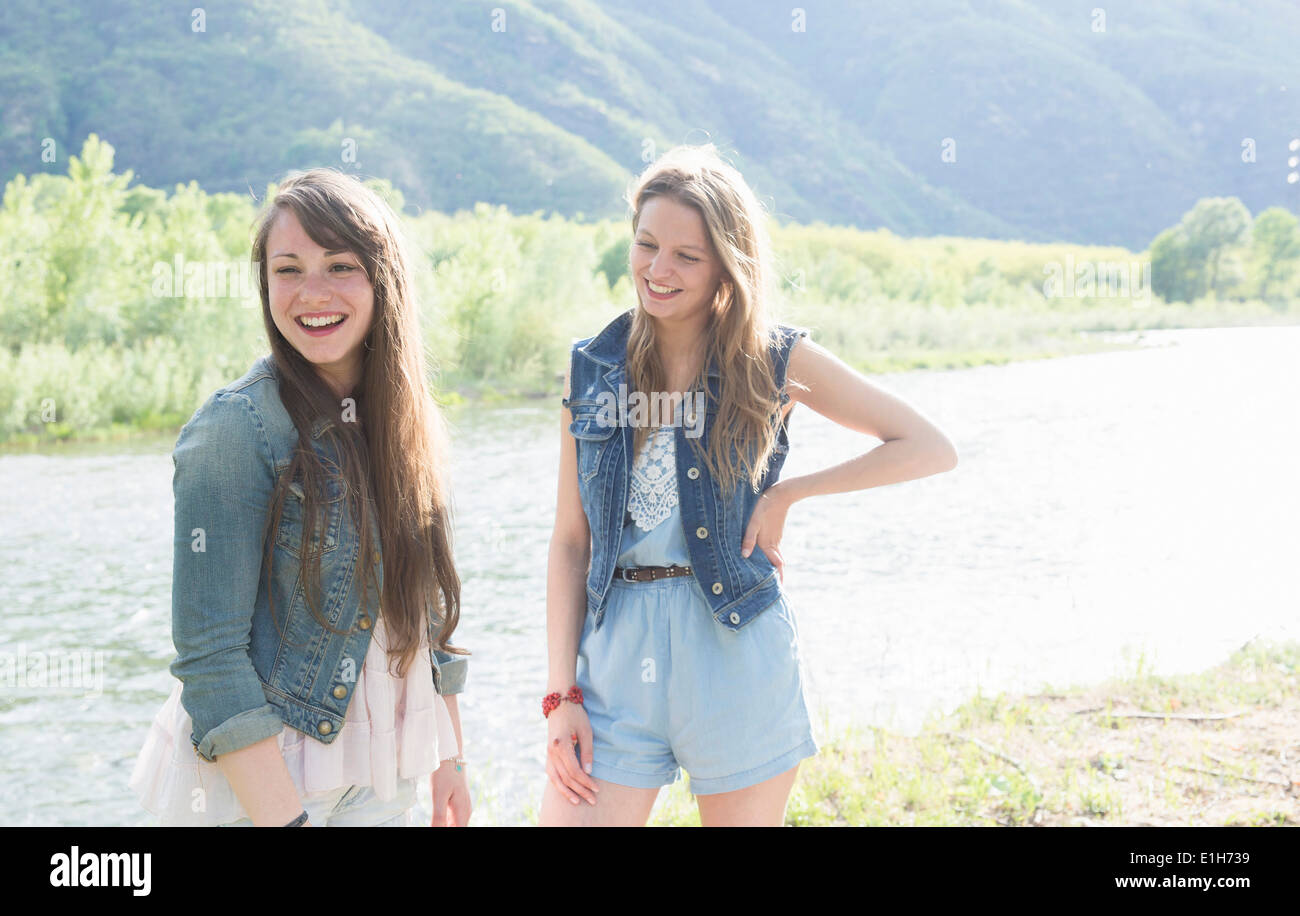 Two female friends on riverbank hi-res stock photography and images - Alamy