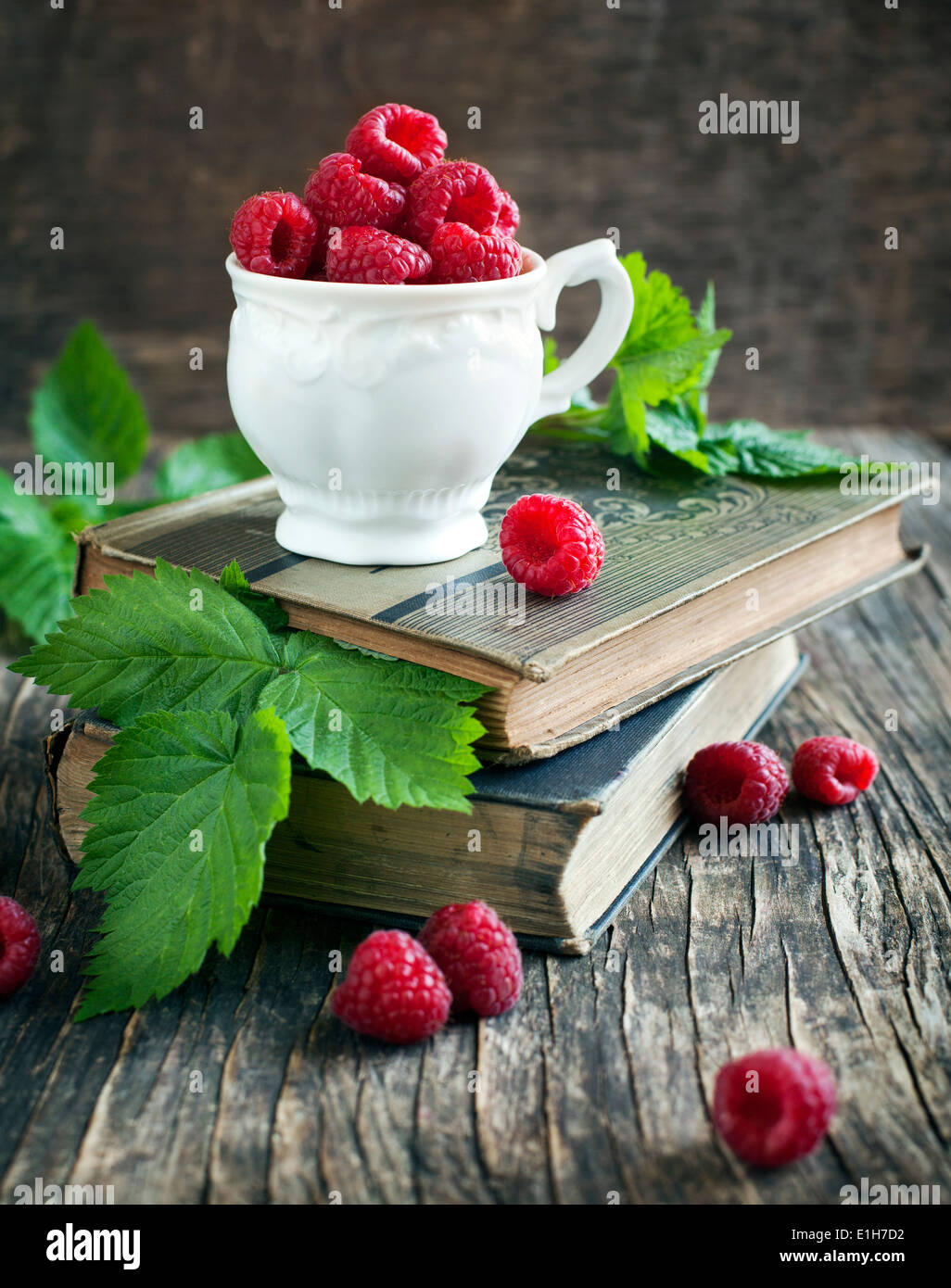 Fresh raspberries in cup Stock Photo - Alamy
