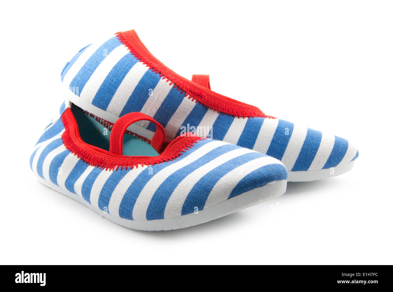 pair of striped shoes isolated on white background Stock Photo - Alamy