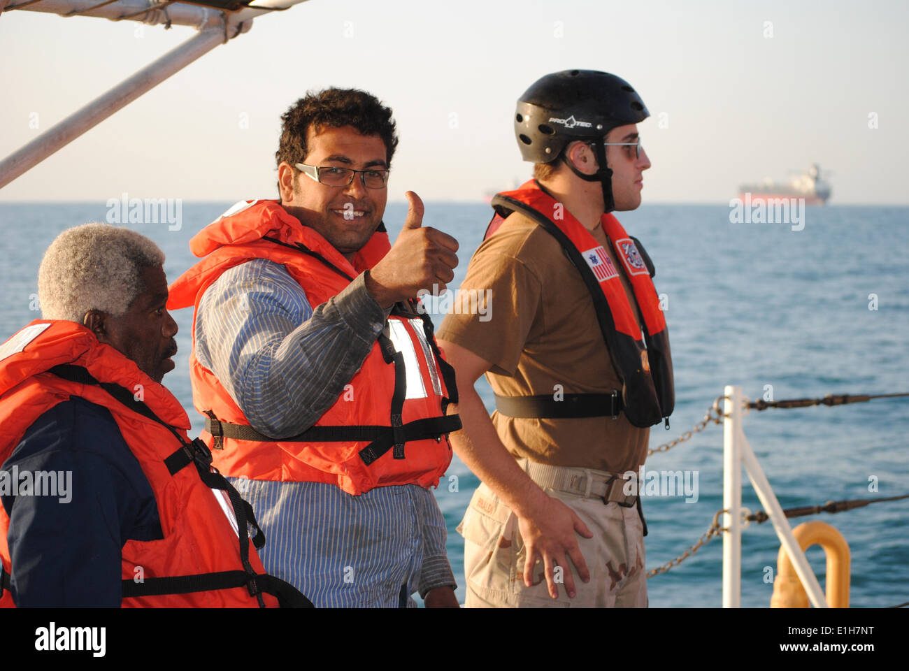 An Iranian mariner gives a thumbs up while aboard U.S. Coast Guard ...