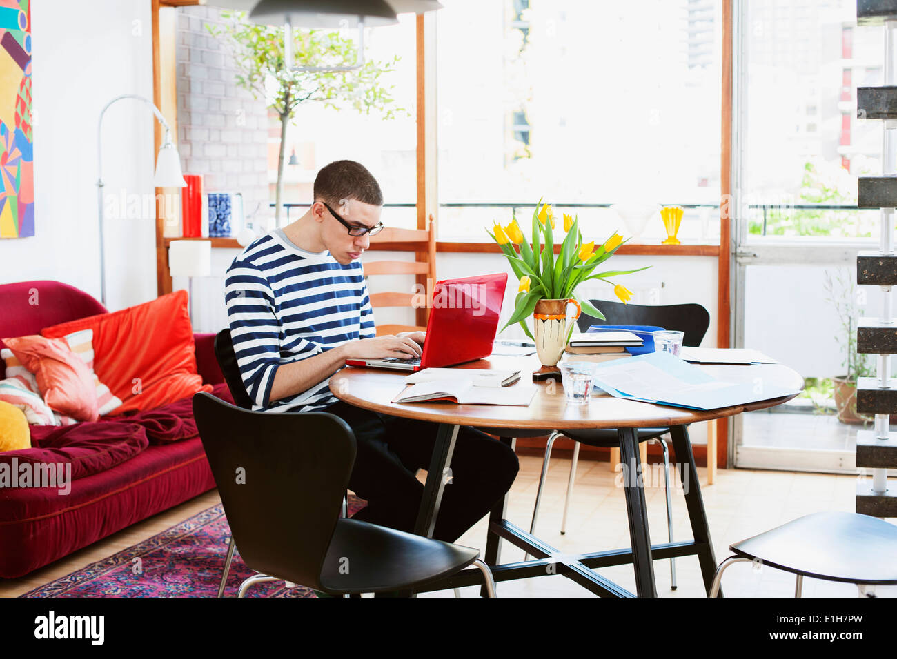 Man sitting at table hi-res stock photography and images - Alamy