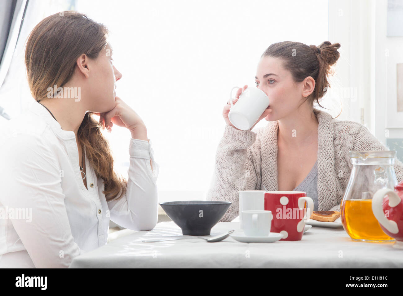 Young women having breakfast Stock Photo - Alamy