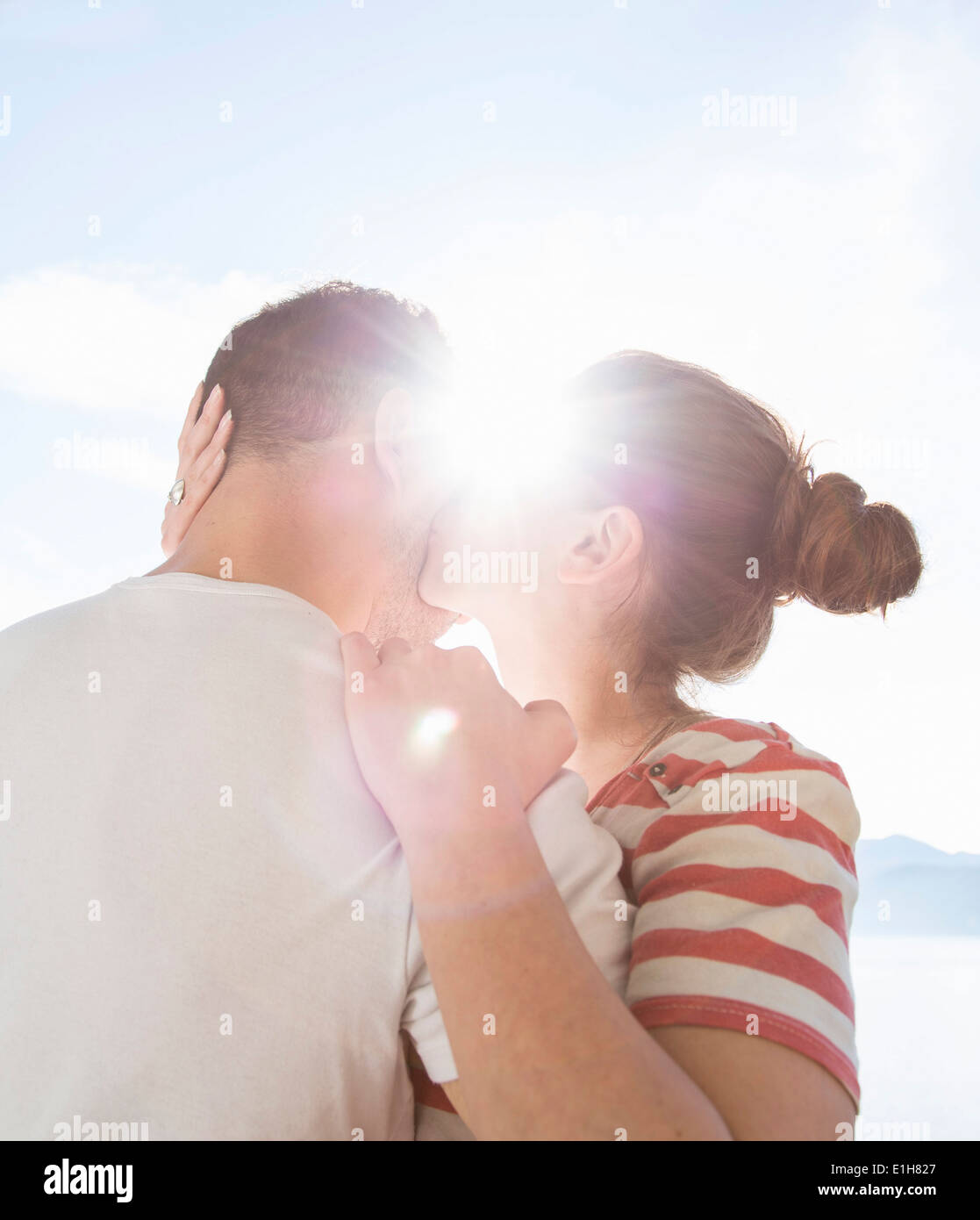 Young couple kissing Stock Photo - Alamy