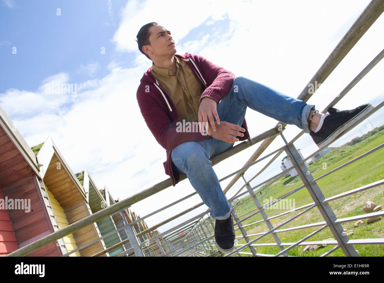 Man sitting fence hi-res stock photography and images - Alamy