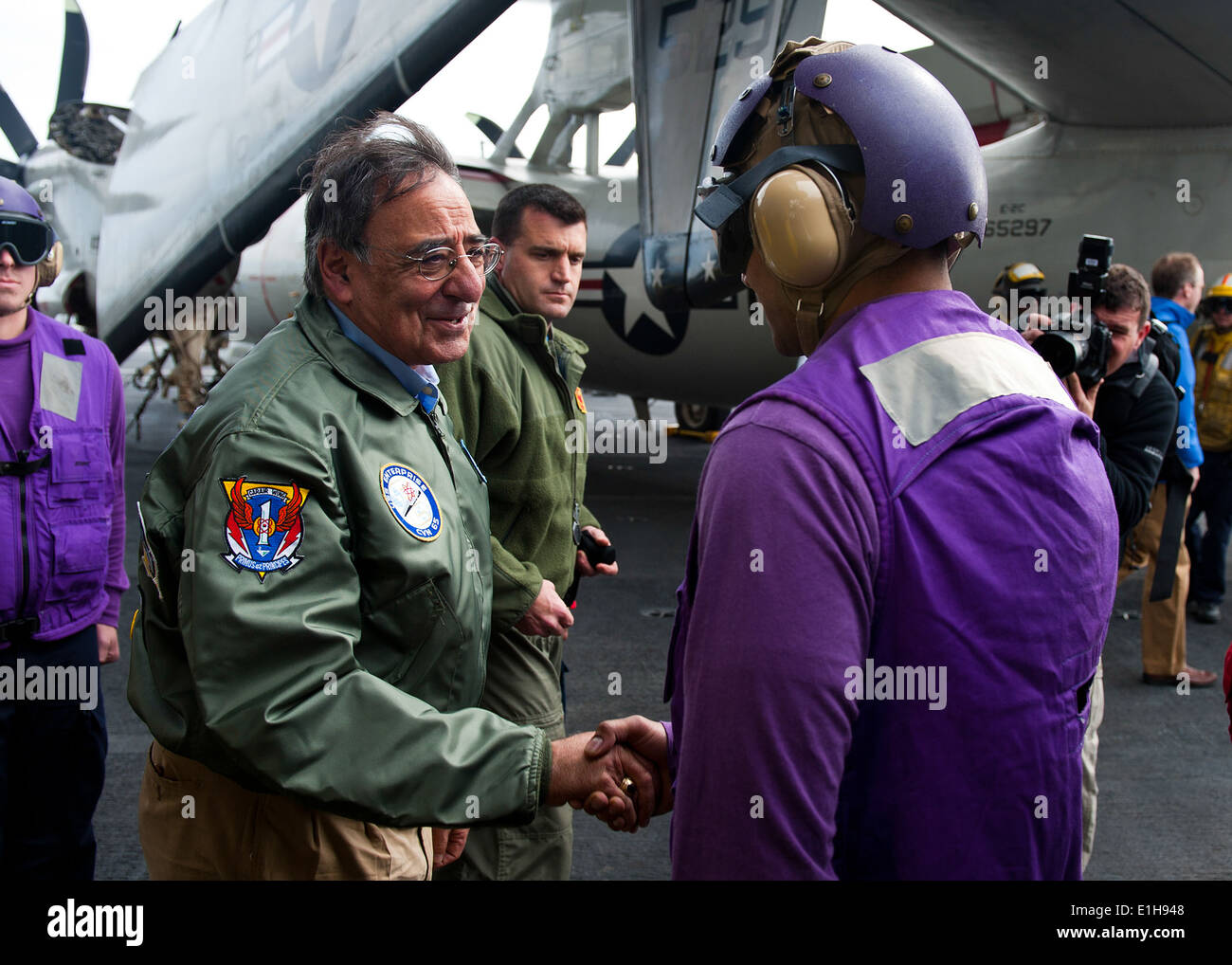 Secretary of Defense Leon Panetta, center, exchanges greetings with a U ...