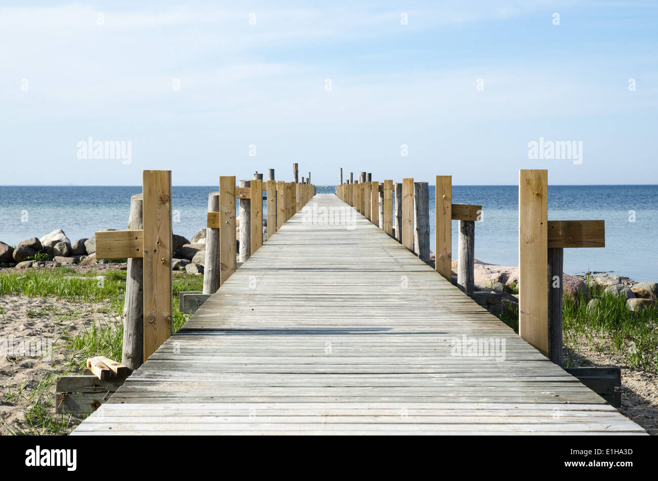 Low angle photo of a wooden bath pier straight into the water Stock ...