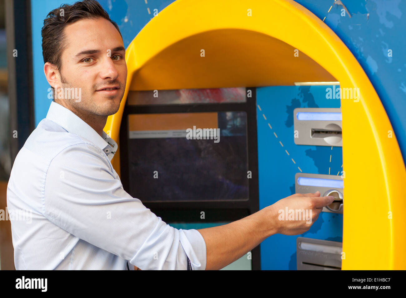 Man at the ATM Stock Photo - Alamy