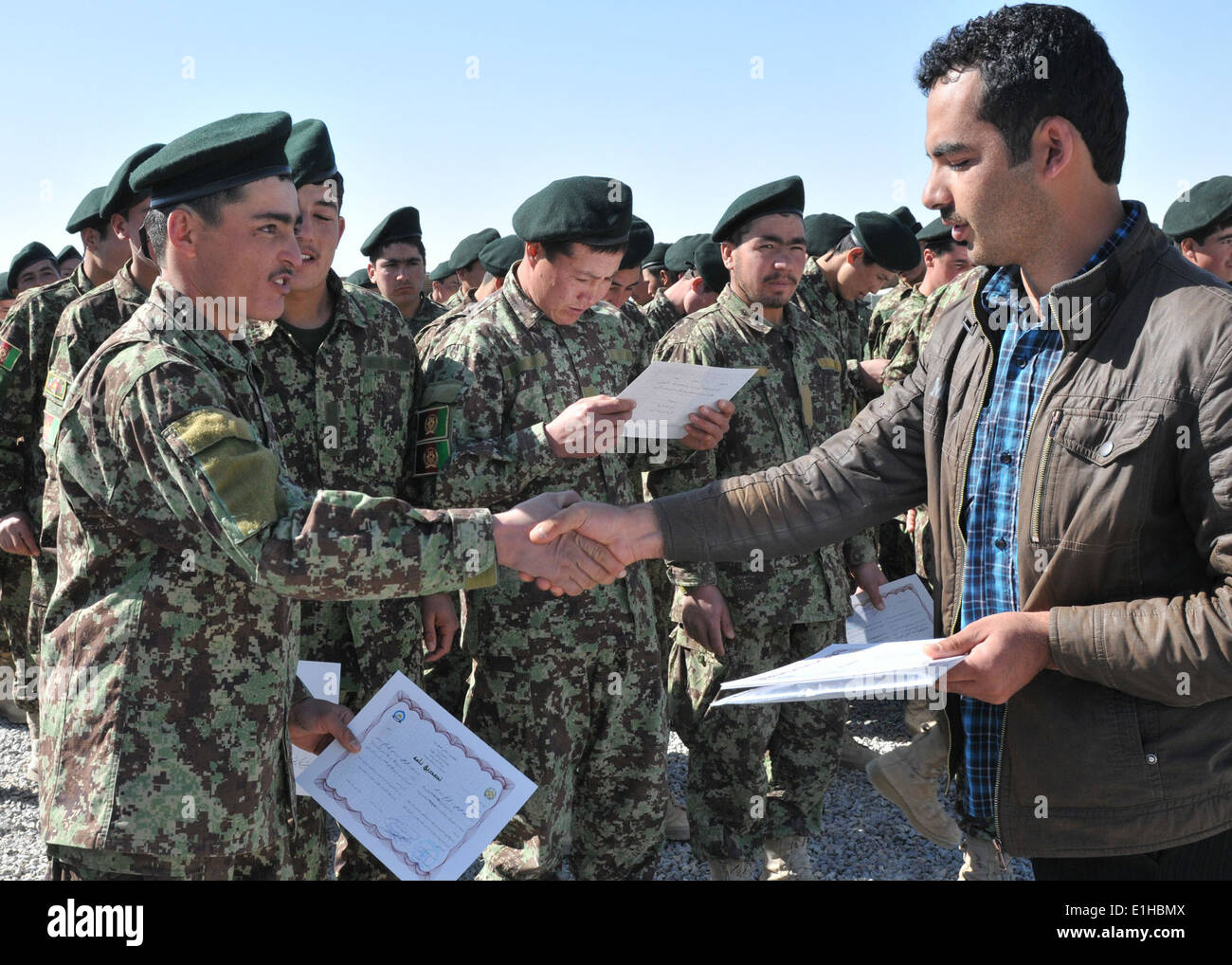 Receives his literacy course completion certificate at graduation ...