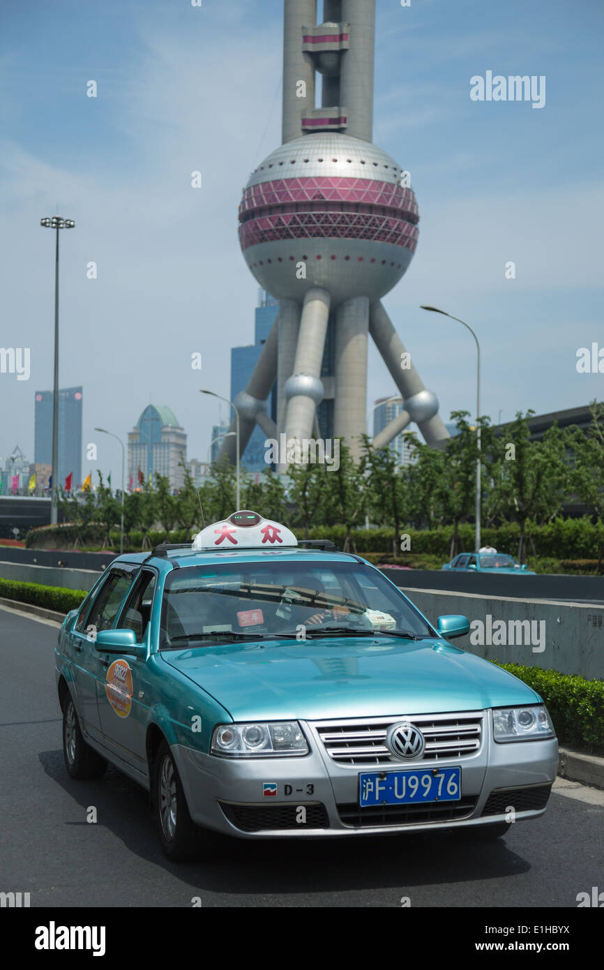 A taxi driving on the road in Shanghai, China Stock Photo - Alamy